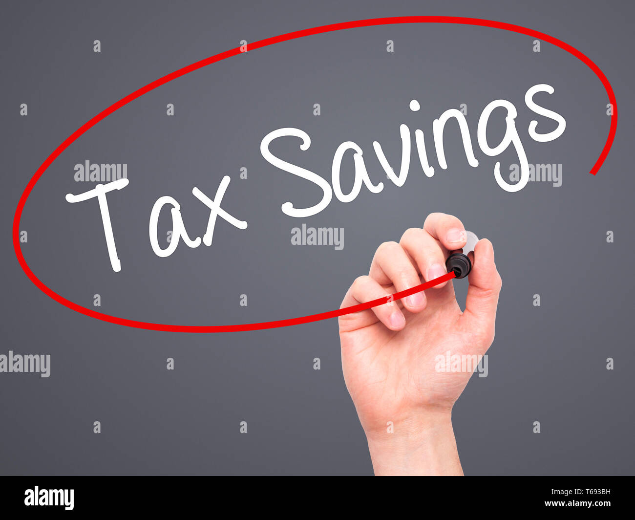 Man Hand writing Tax Savings with black marker on visual screen Stock ...