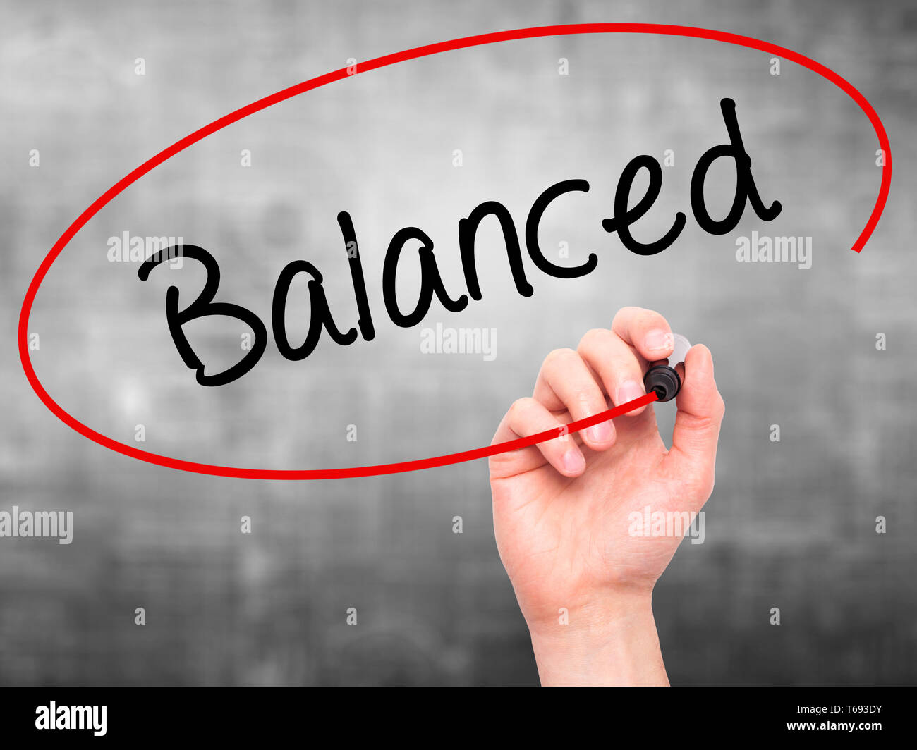 Man Hand writing Balanced with black marker on visual screen Stock ...