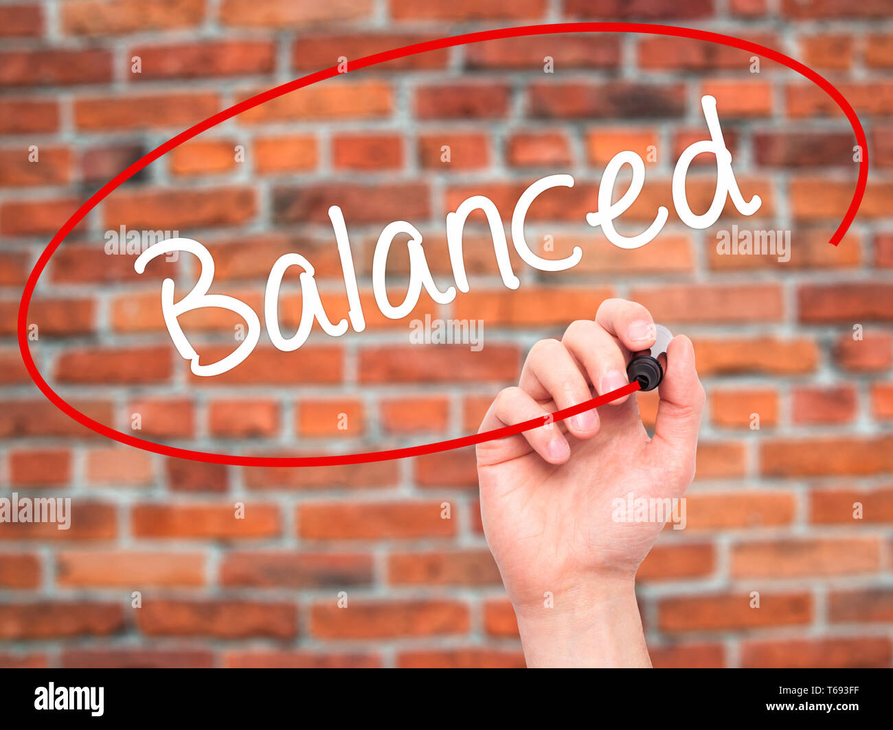 Man Hand writing Balanced with black marker on visual screen Stock ...