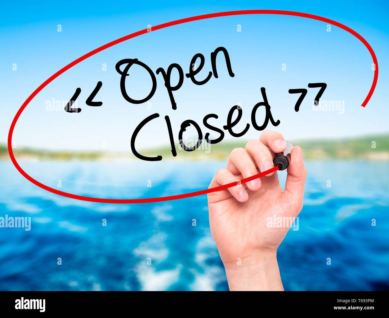 Man Hand writing Open - Closed with black marker on visual screen Stock ...