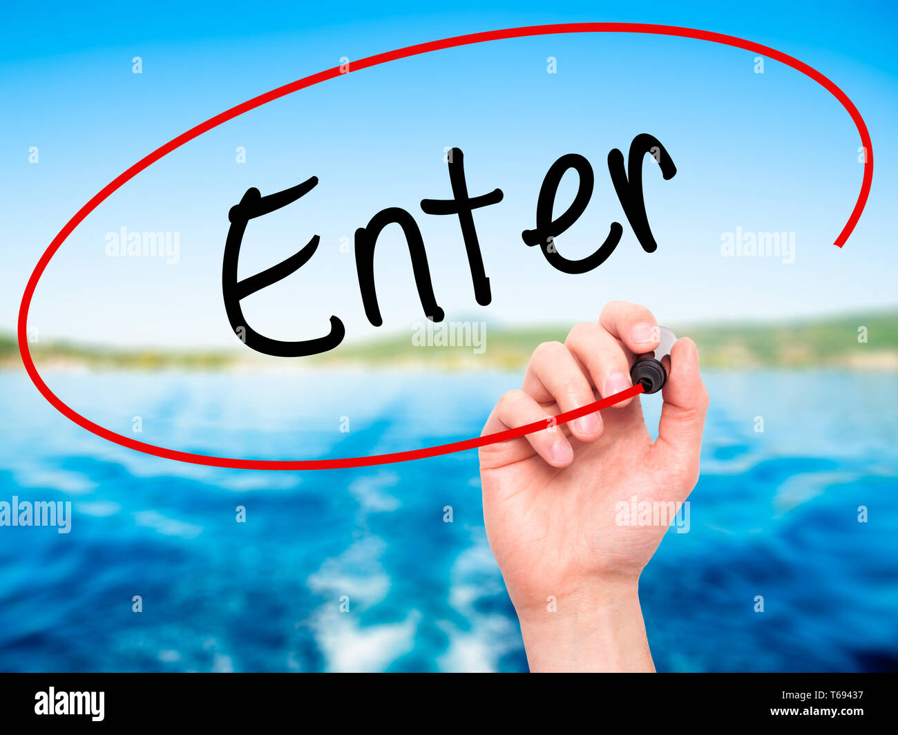 Man Hand writing Enter with black marker on visual screen Stock Photo ...