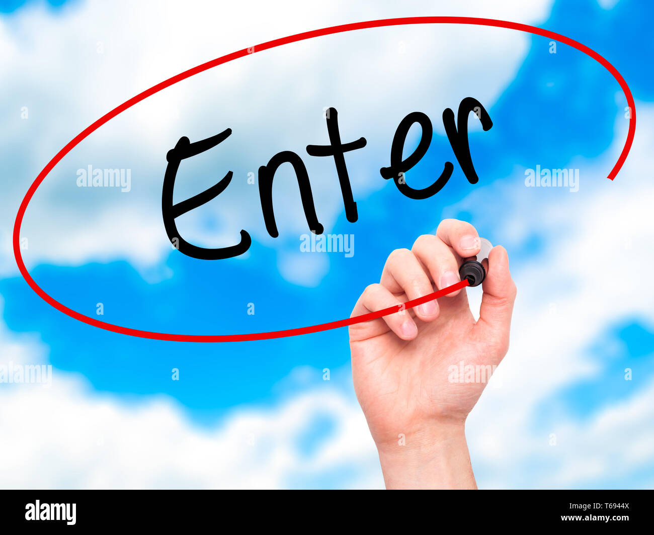 Man Hand writing Enter with black marker on visual screen Stock Photo ...
