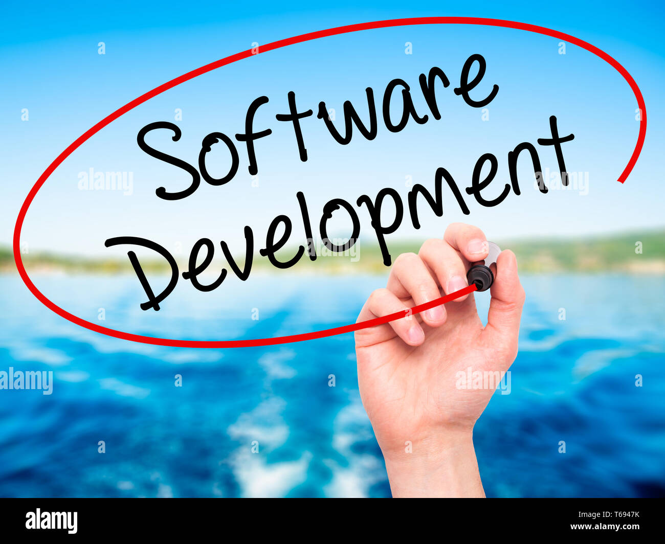 Man Hand writing Software Development with black marker on visual ...