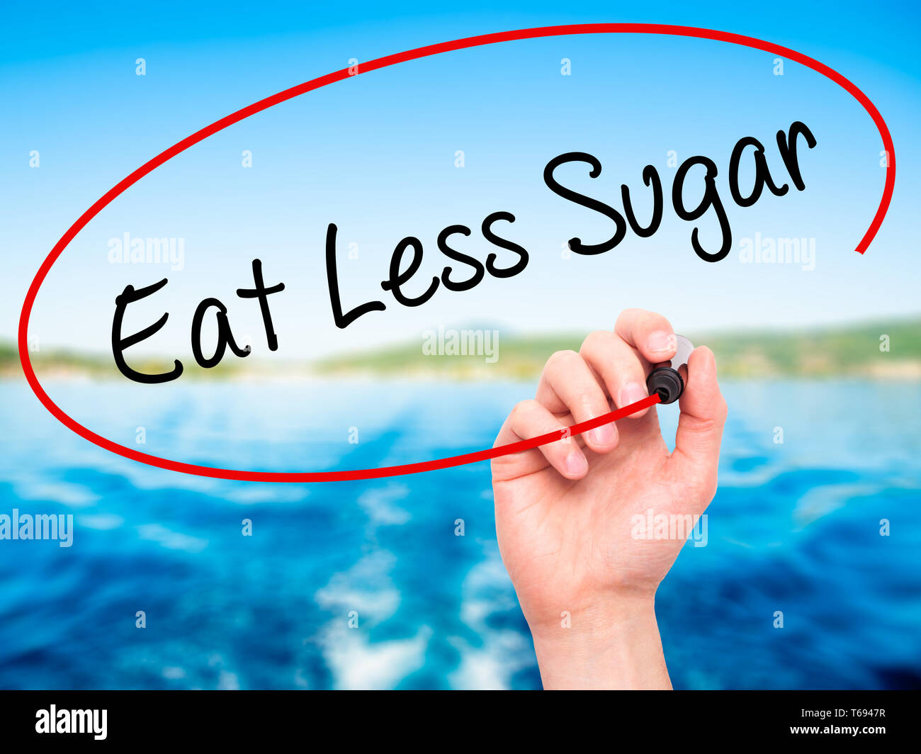 Man Hand writing Eat Less Sugar with black marker on visual screen ...