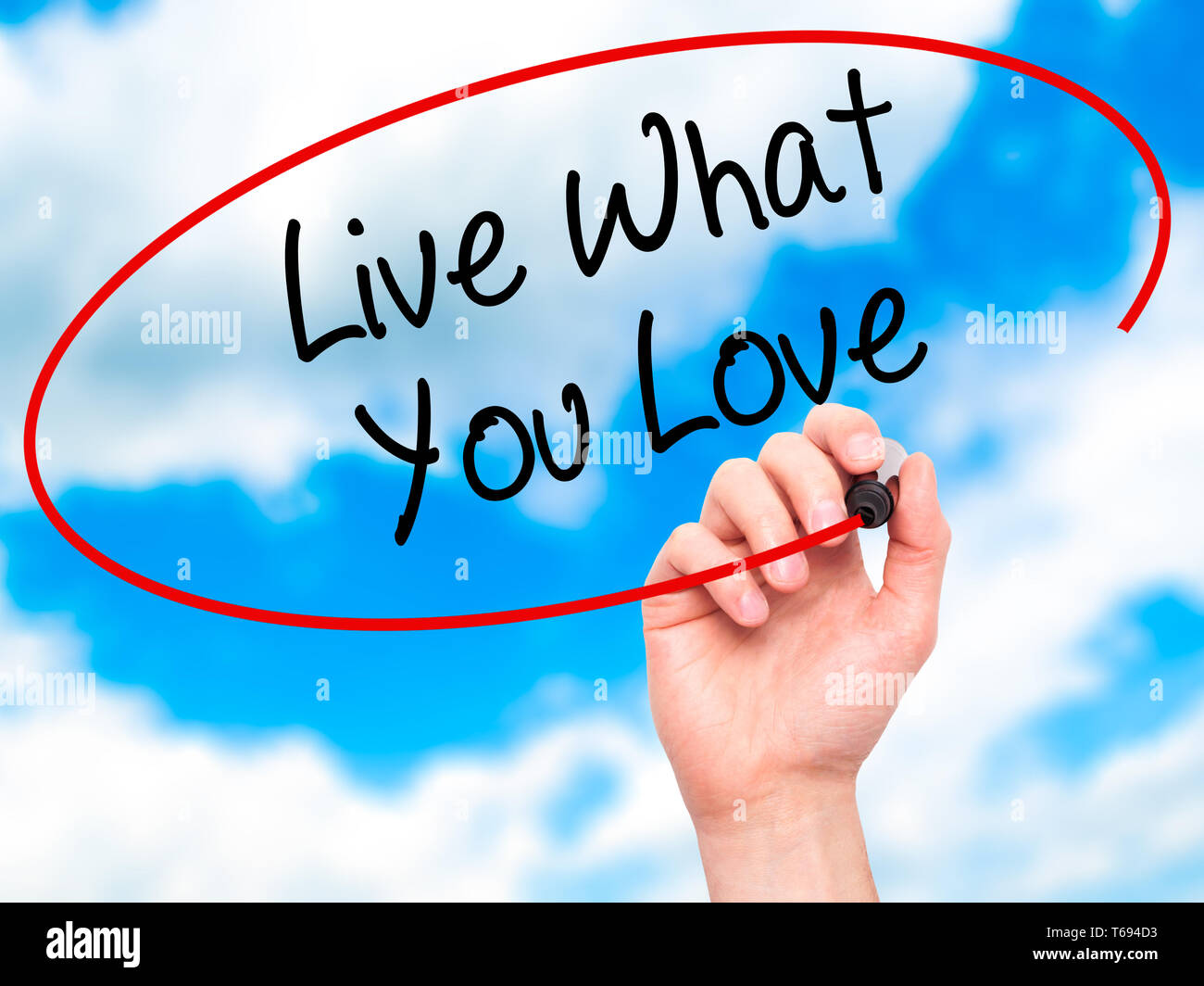 Man Hand writing Live What You Love with black marker on visual screen ...