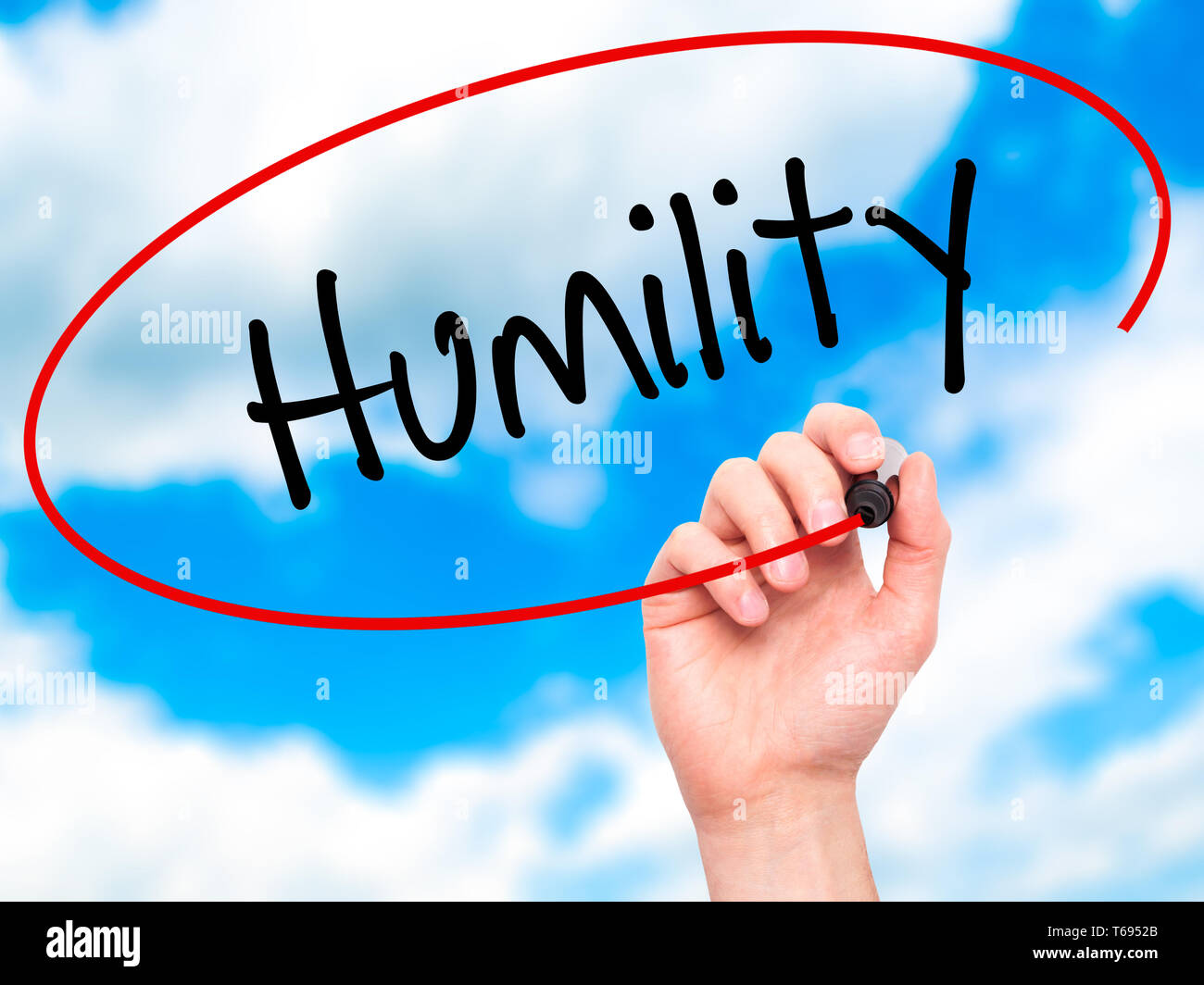 Man Hand writing Humility with black marker on visual screen Stock ...