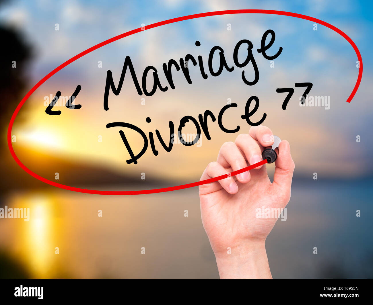 Man Hand writing Marriage - Divorce with black marker on visual screen ...