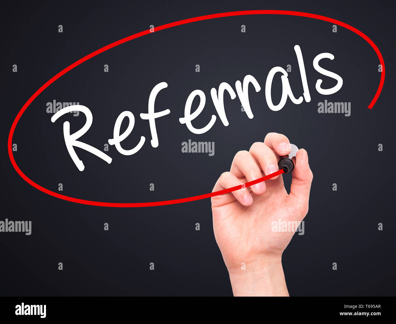 Man Hand writing Referrals with black marker on visual screen Stock ...