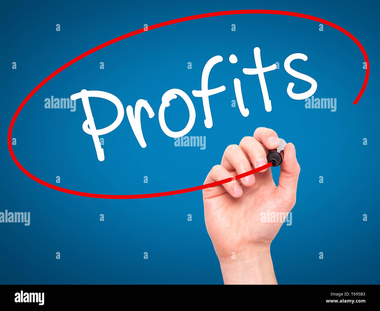 Man Hand writing Profits with black marker on visual screen Stock Photo ...