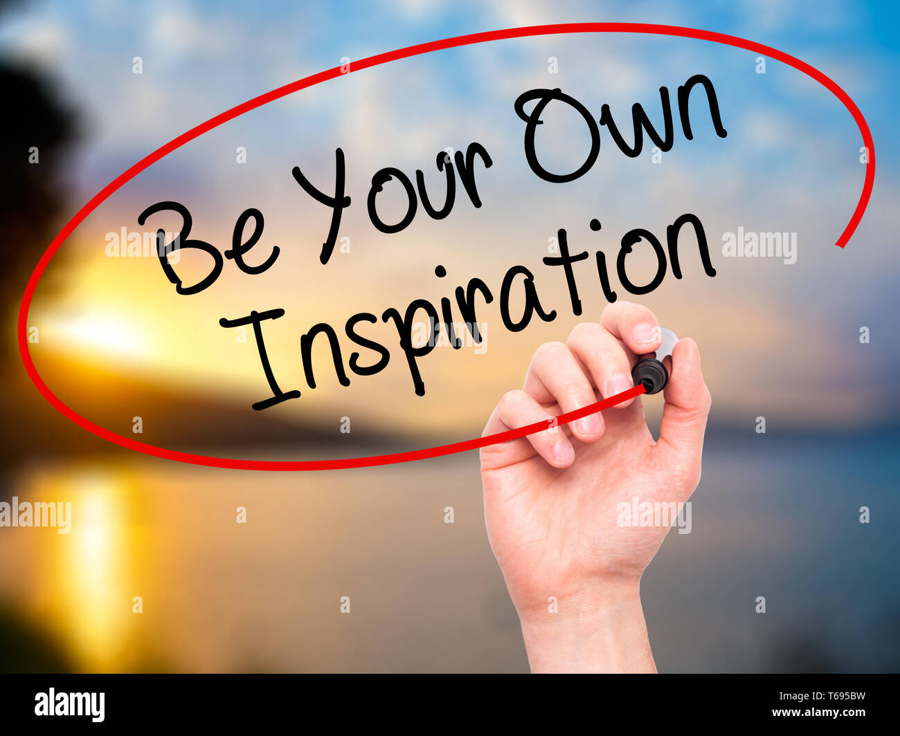 Man Hand writing Be Your Own Inspiration with black marker on visual ...
