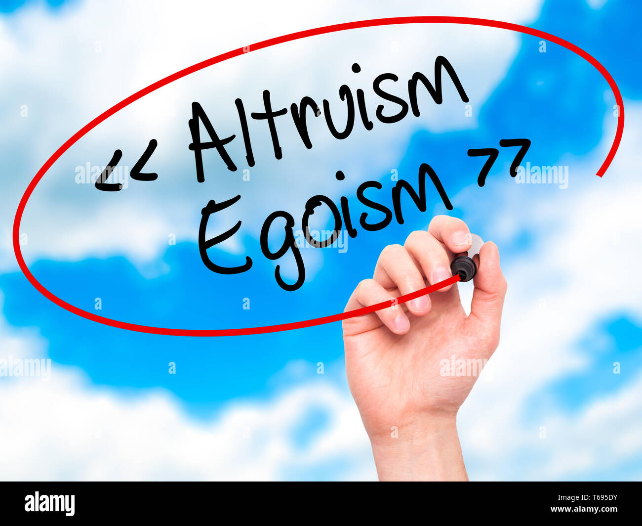 Man Hand writing Altruism - Egoism with black marker on visual screen ...