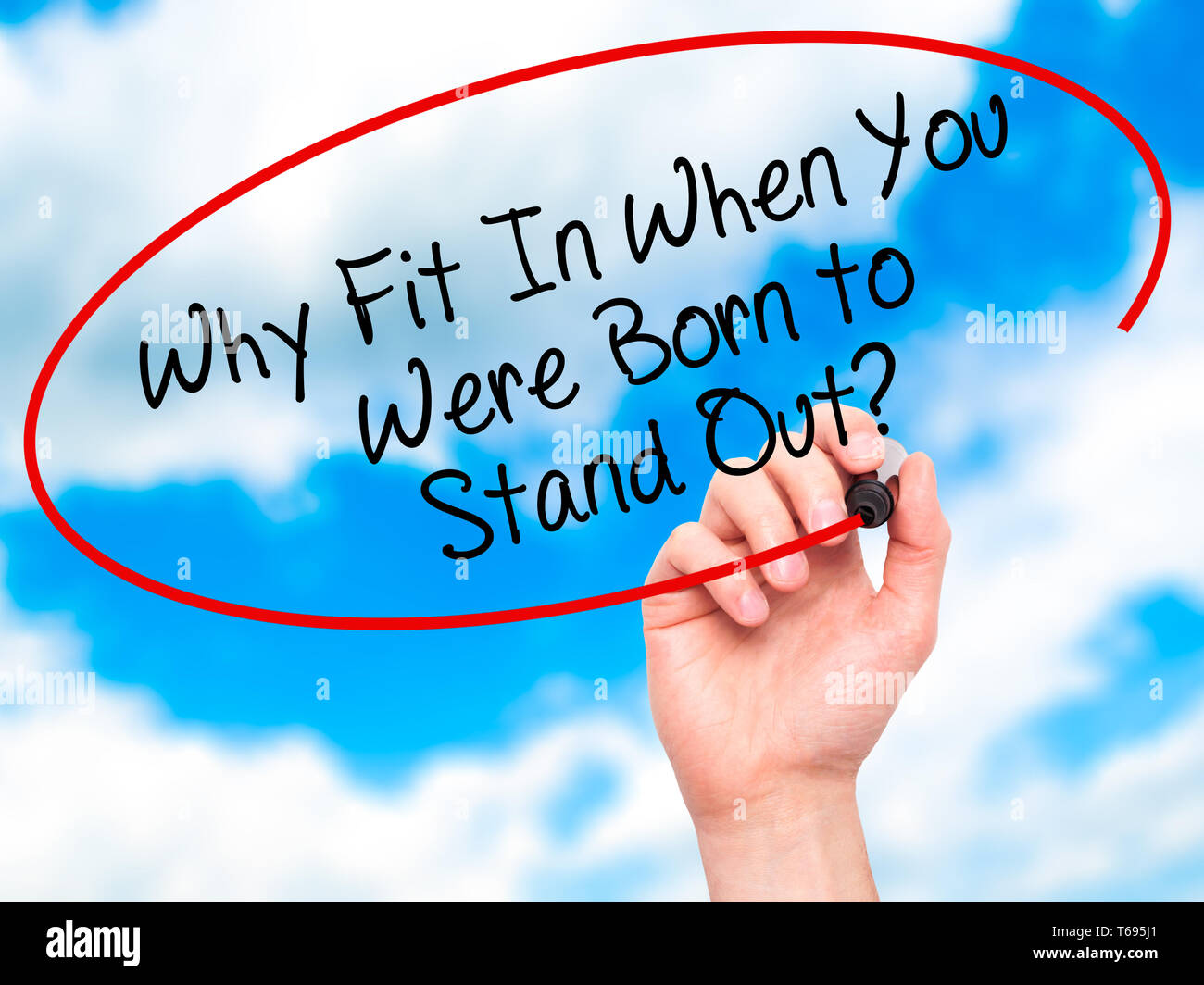 Man Hand writing Why Fit In When You Were Born to Stand Out? with black ...