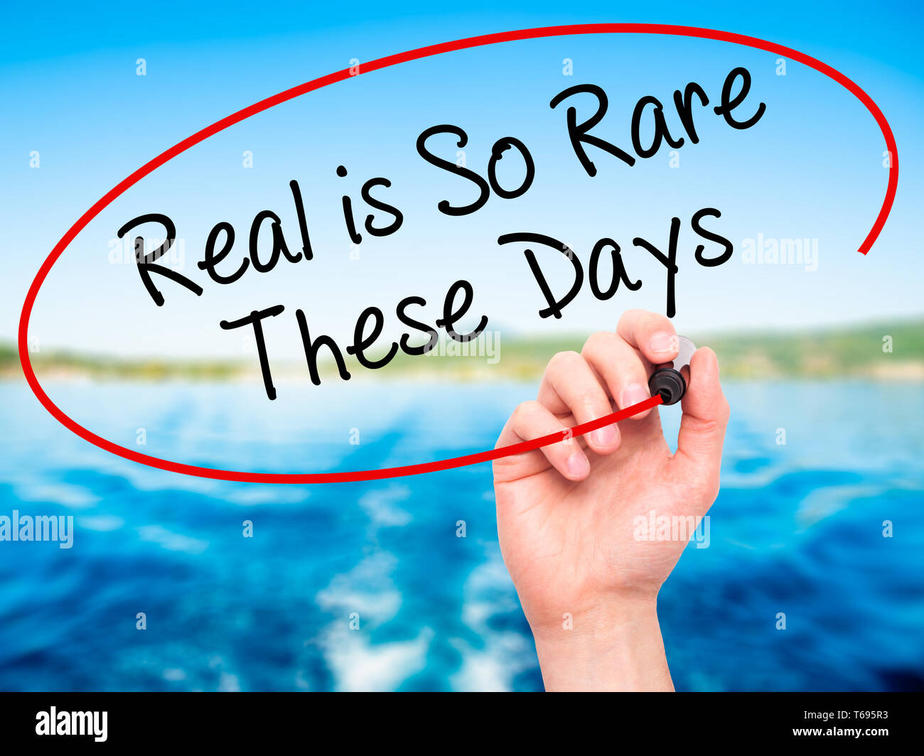 Man Hand writing Real is So Rare These Days with black marker on visual ...