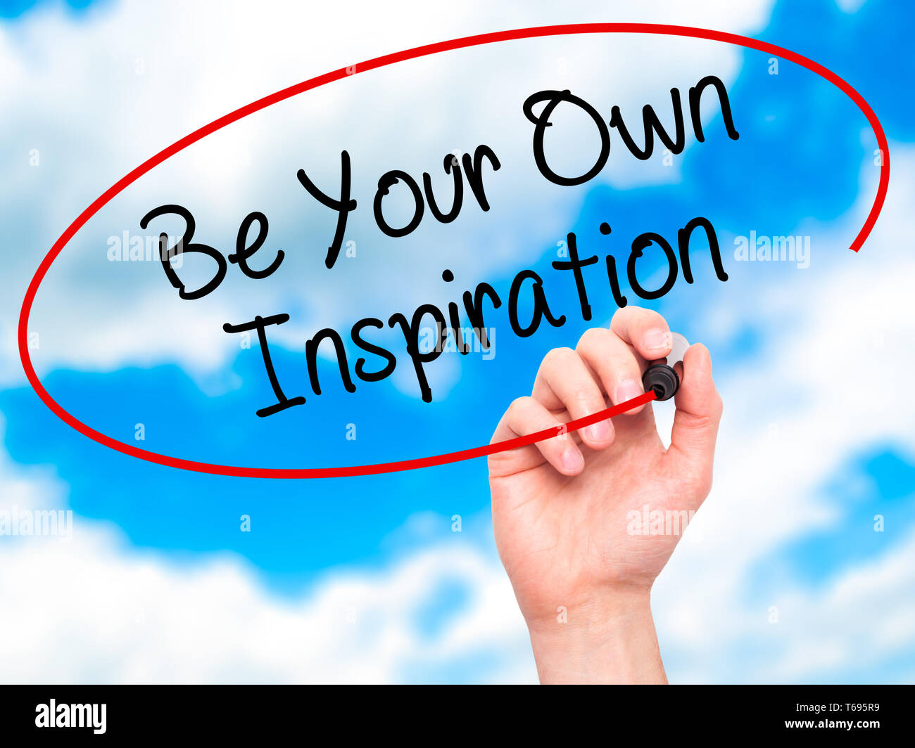 Man Hand writing Be Your Own Inspiration with black marker on visual ...