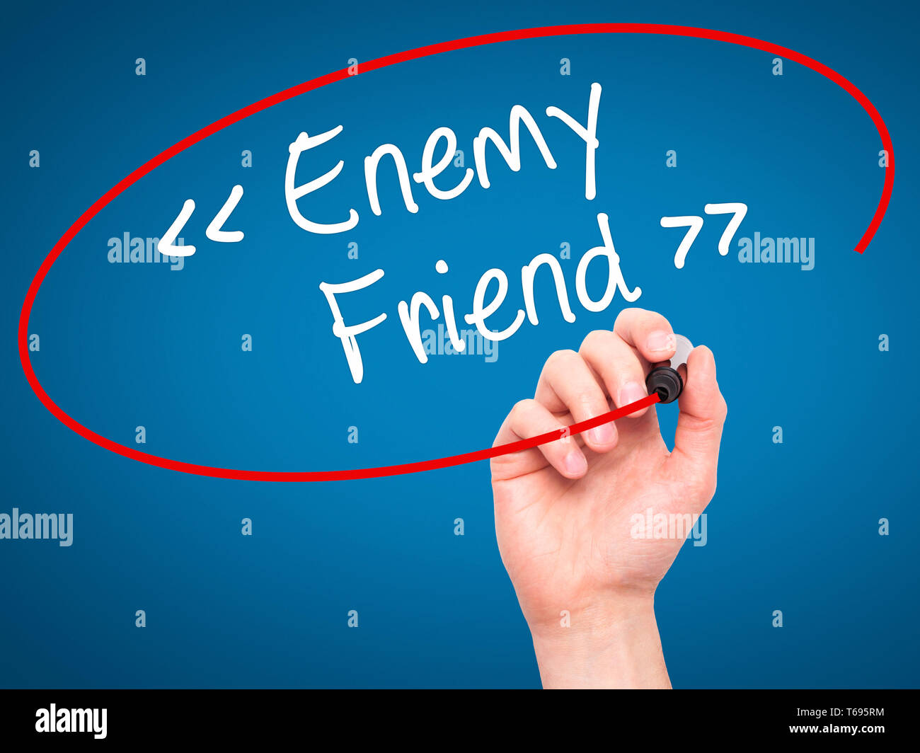 Man Hand writing Enemy - Friend with black marker on visual screen ...