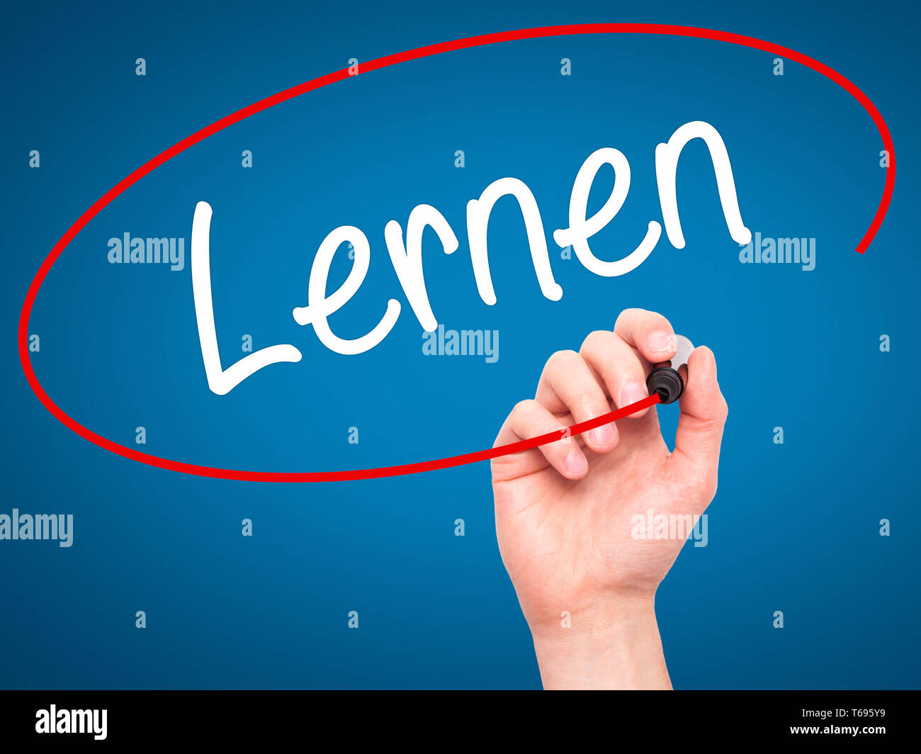 Man Hand writing Lernen (Learn in German) with black marker on visual ...