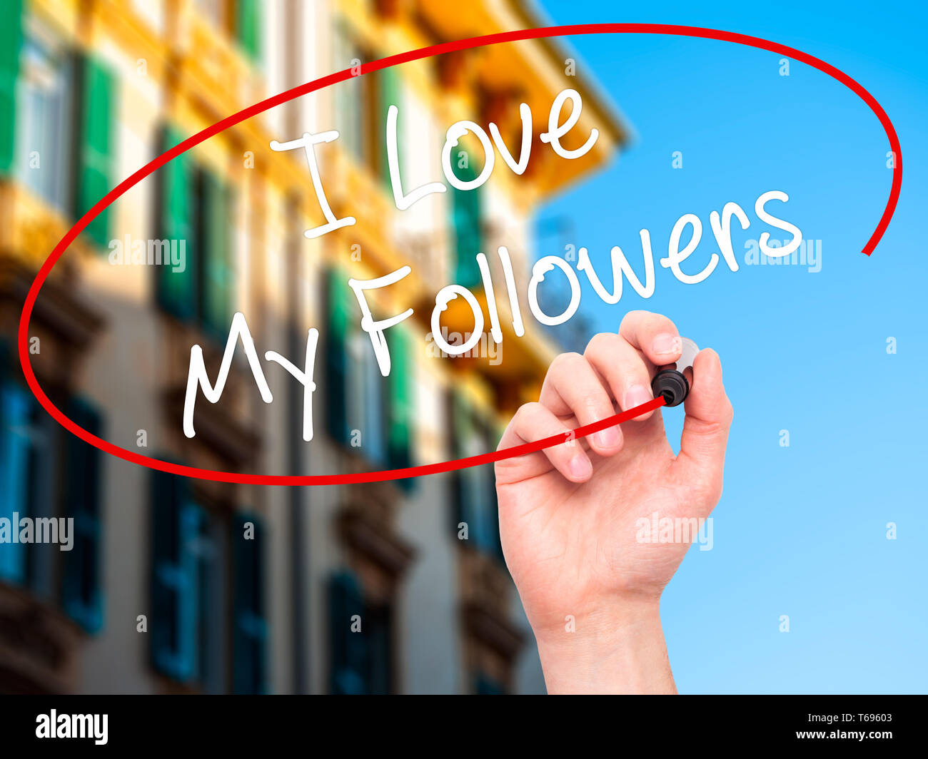 Man Hand writing I Love My Followers with black marker on visual screen ...