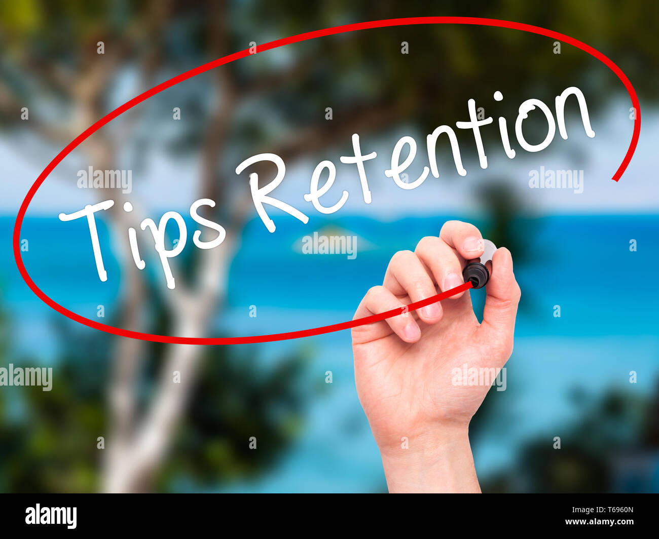 Man Hand writing Tips Retention with black marker on visual screen ...