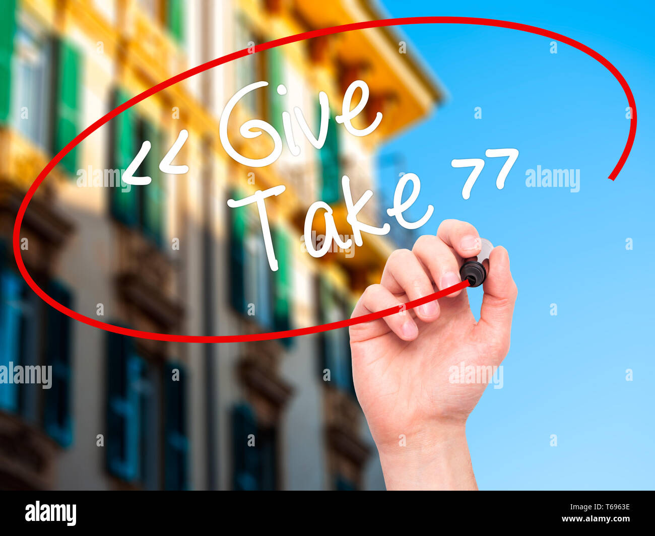 Man Hand writing Give - Take with black marker on visual screen Stock ...