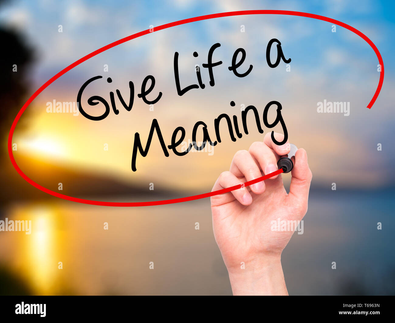 Man Hand writing Give Life a Meaning with black marker on visual screen ...