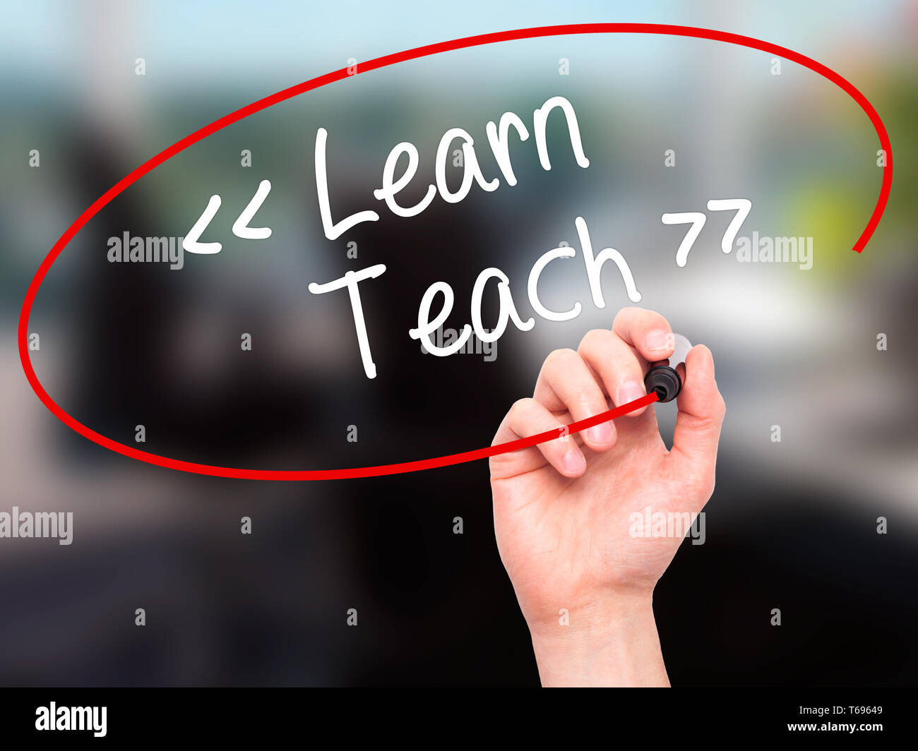 Man Hand writing Learn - Teach with black marker on visual screen Stock ...