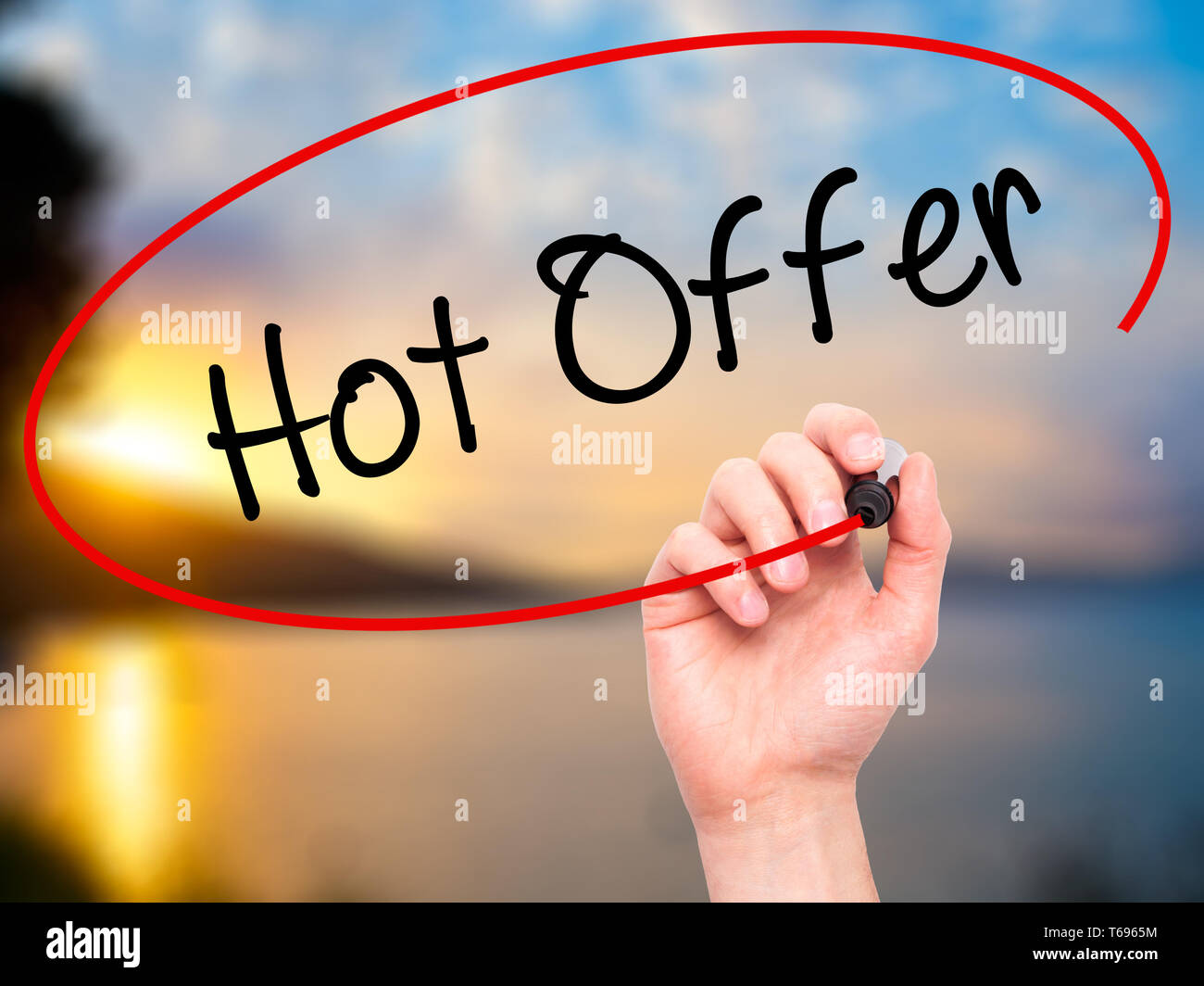 Man Hand writing Hot Offer with black marker on visual screen Stock ...