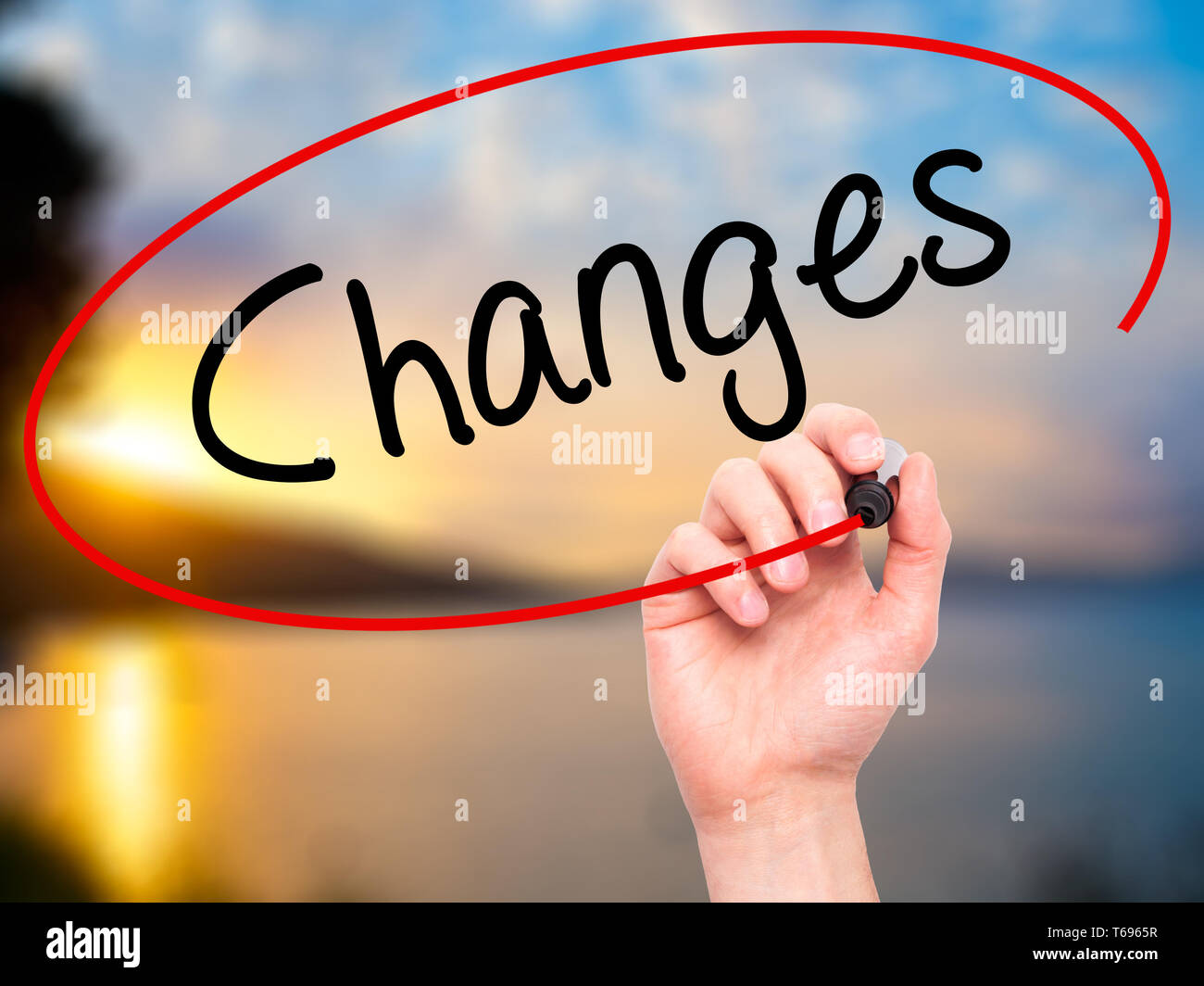 Man Hand writing Changes with black marker on visual screen Stock Photo ...