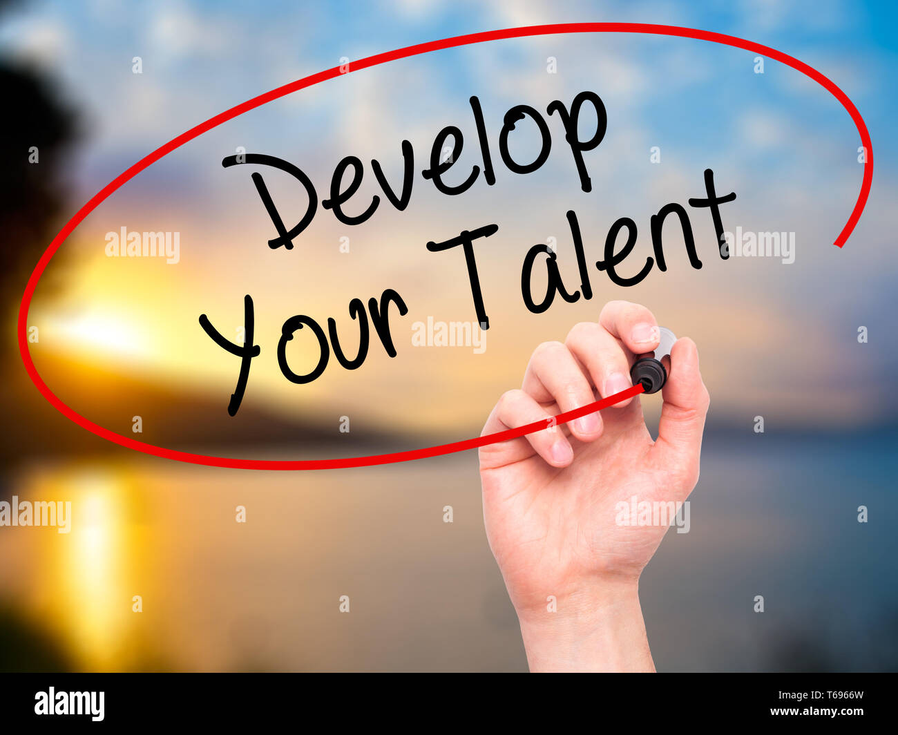 Man Hand writing Develop Your Talent with black marker on visual screen ...