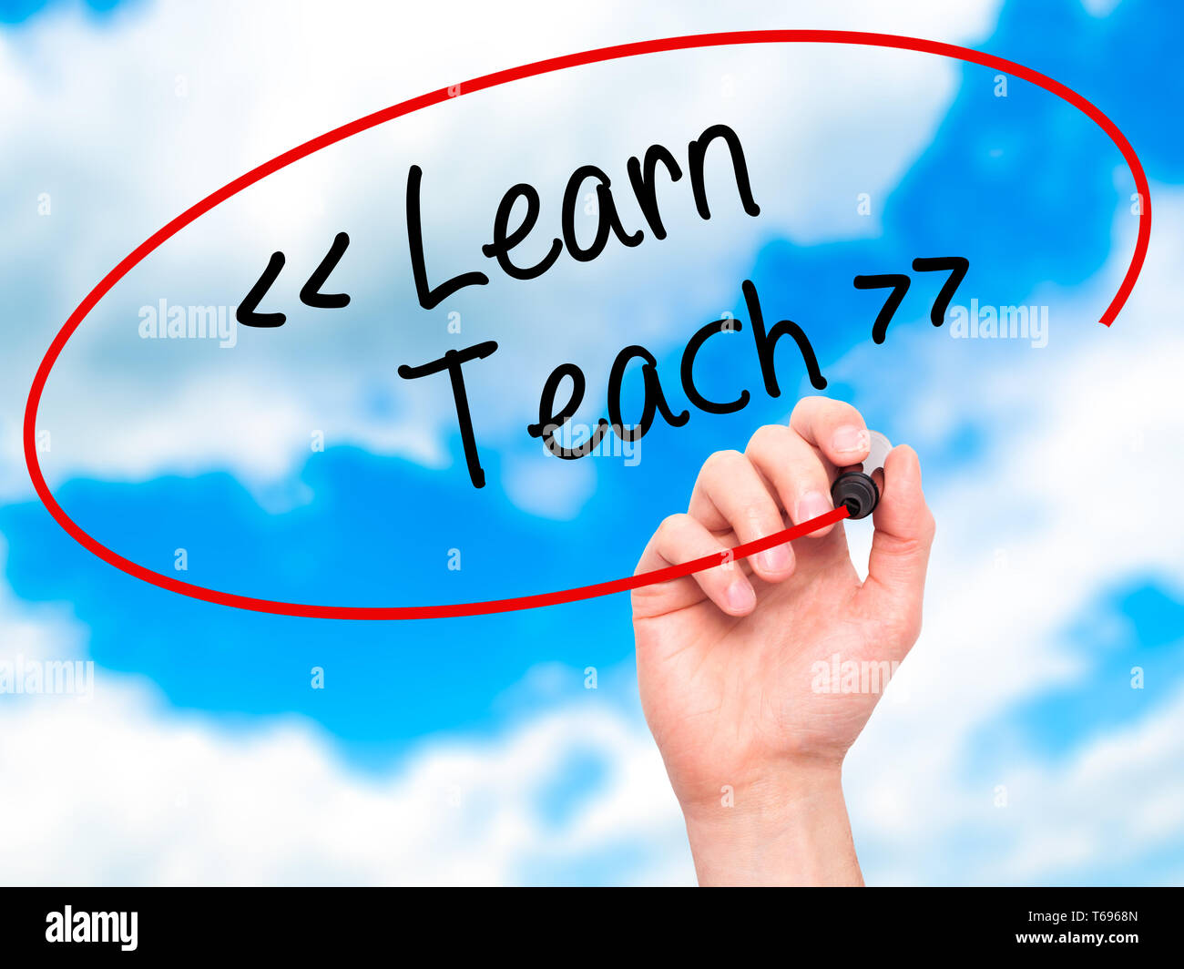 Man Hand writing Learn - Teach with black marker on visual screen Stock ...