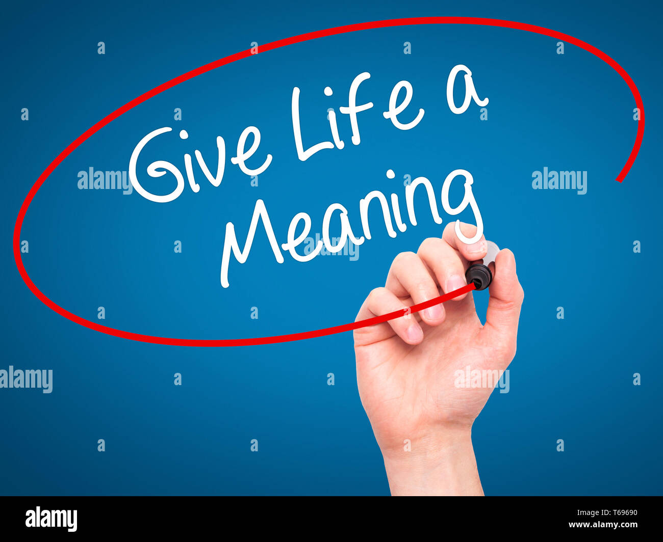 Man Hand writing Give Life a Meaning with black marker on visual screen ...