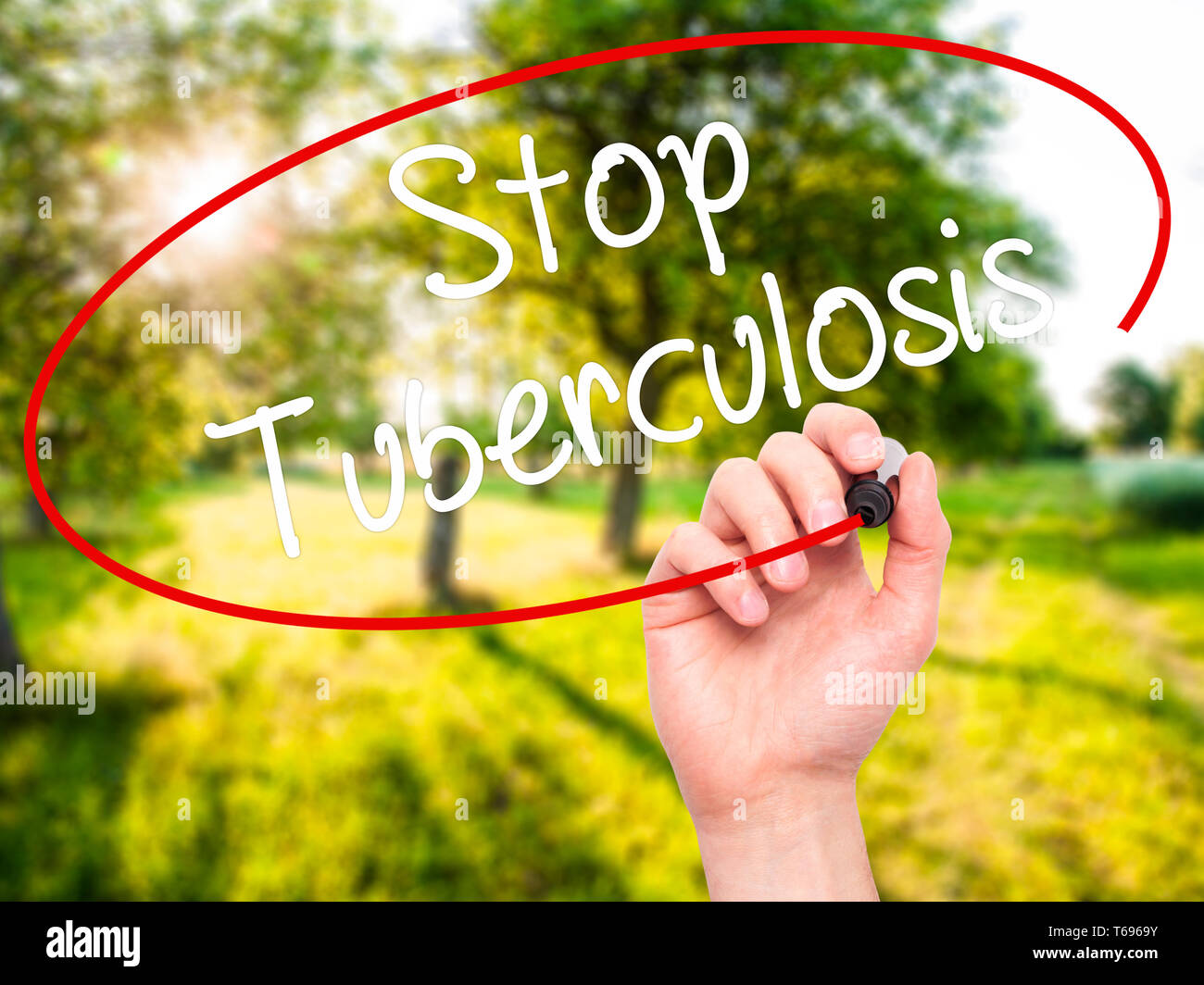 Man Hand writing Stop Tuberculosis with black marker on visual screen ...