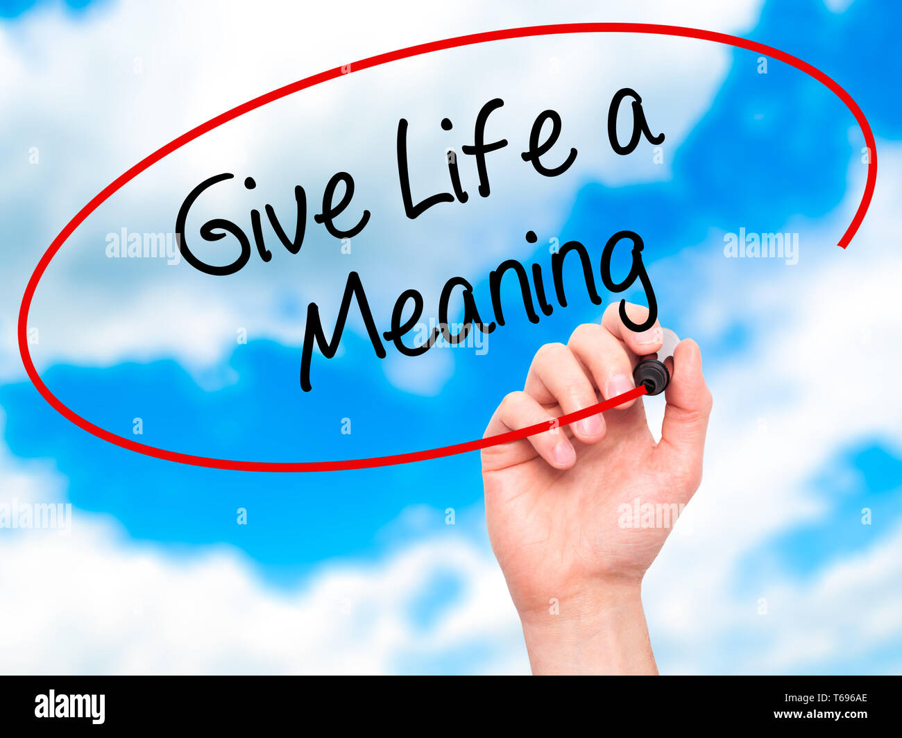 Man Hand writing Give Life a Meaning with black marker on visual screen ...