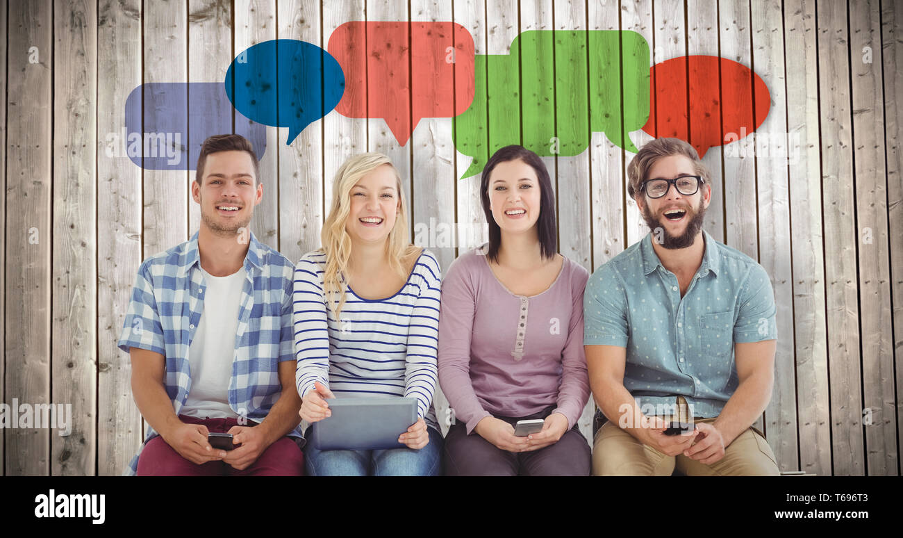 Composite image of portrait of smiling business people holding ...
