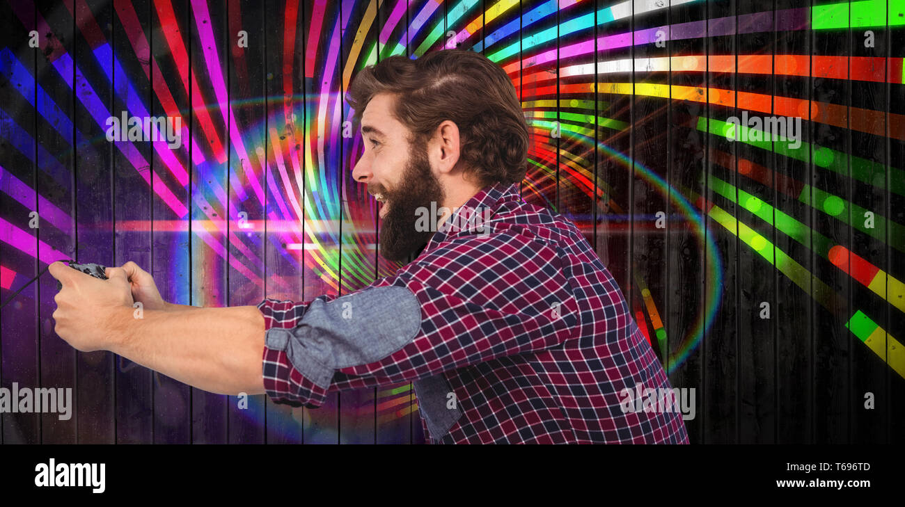 Composite image of side view of happy hipster playing video game Stock ...
