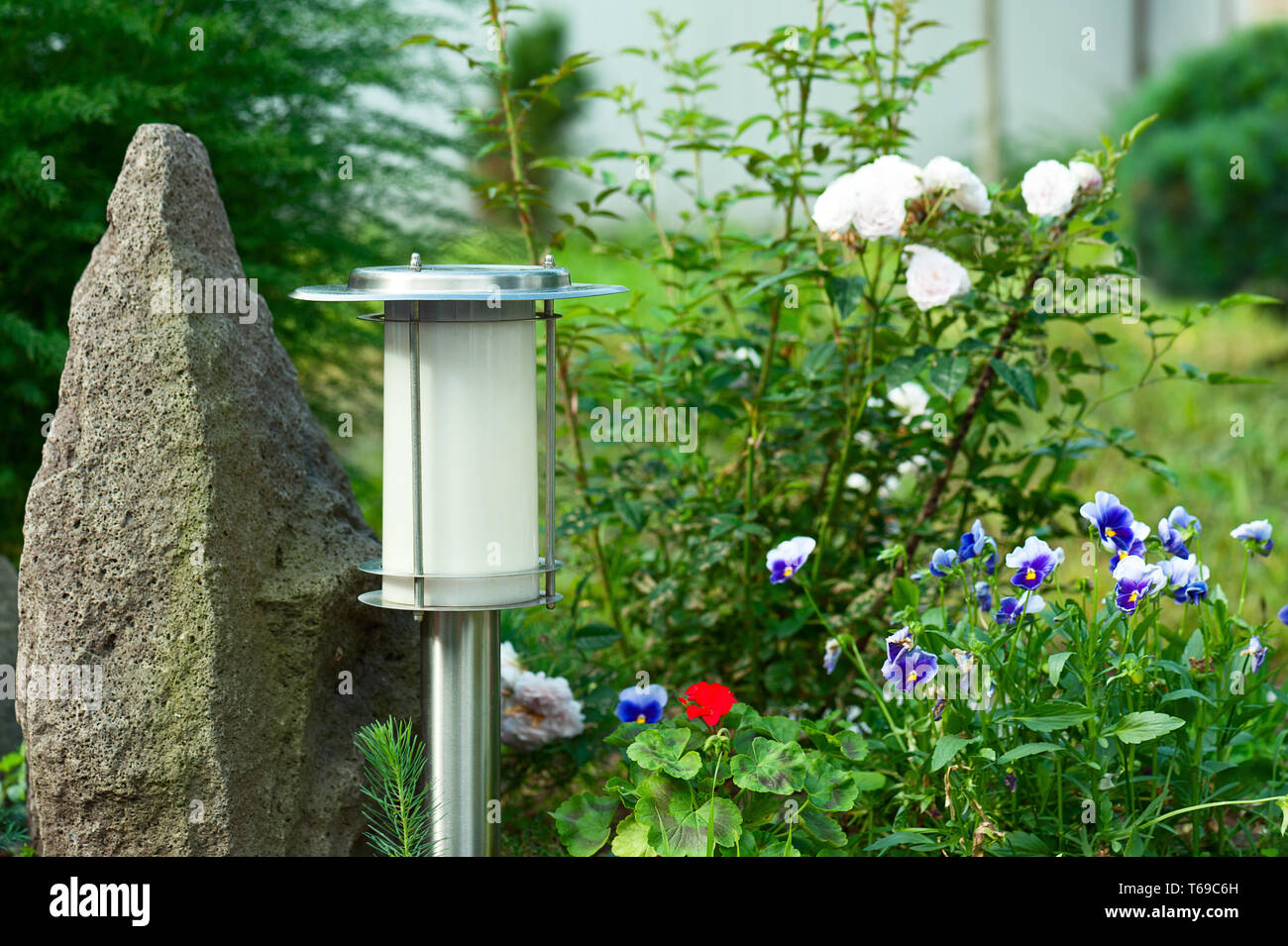Solar Powered Lamp on Garden Background Stock Photo - Alamy
