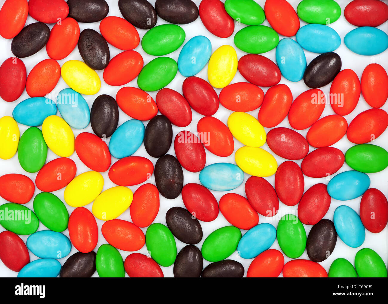 Multicolored candies for use as background Stock Photo - Alamy