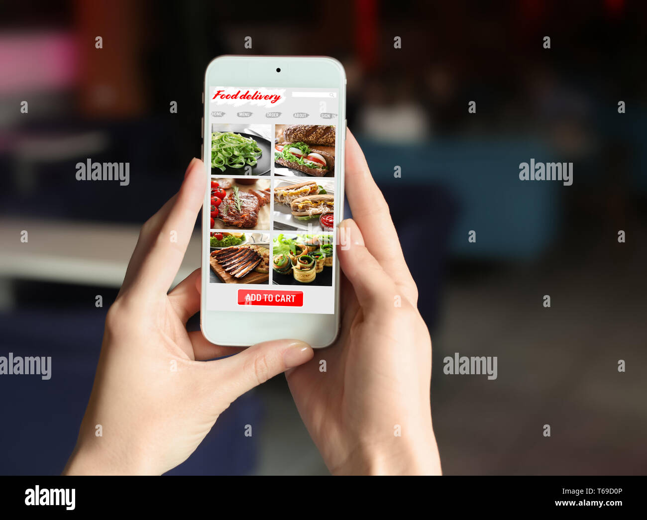 Woman using mobile phone to order food delivery online Stock Photo - Alamy