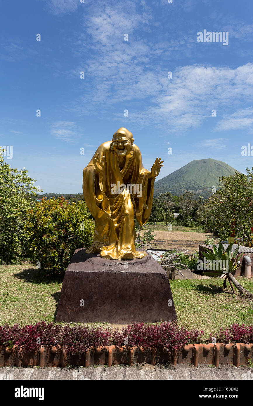 fat monk statue in complex Pagoda Ekayana Stock Photo - Alamy