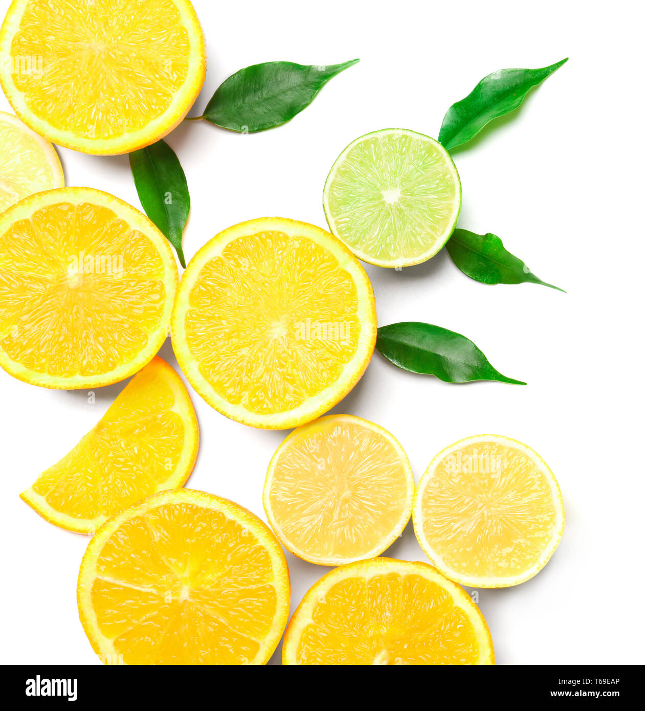 Composition of delicious citrus fruits and green leaves on white ...