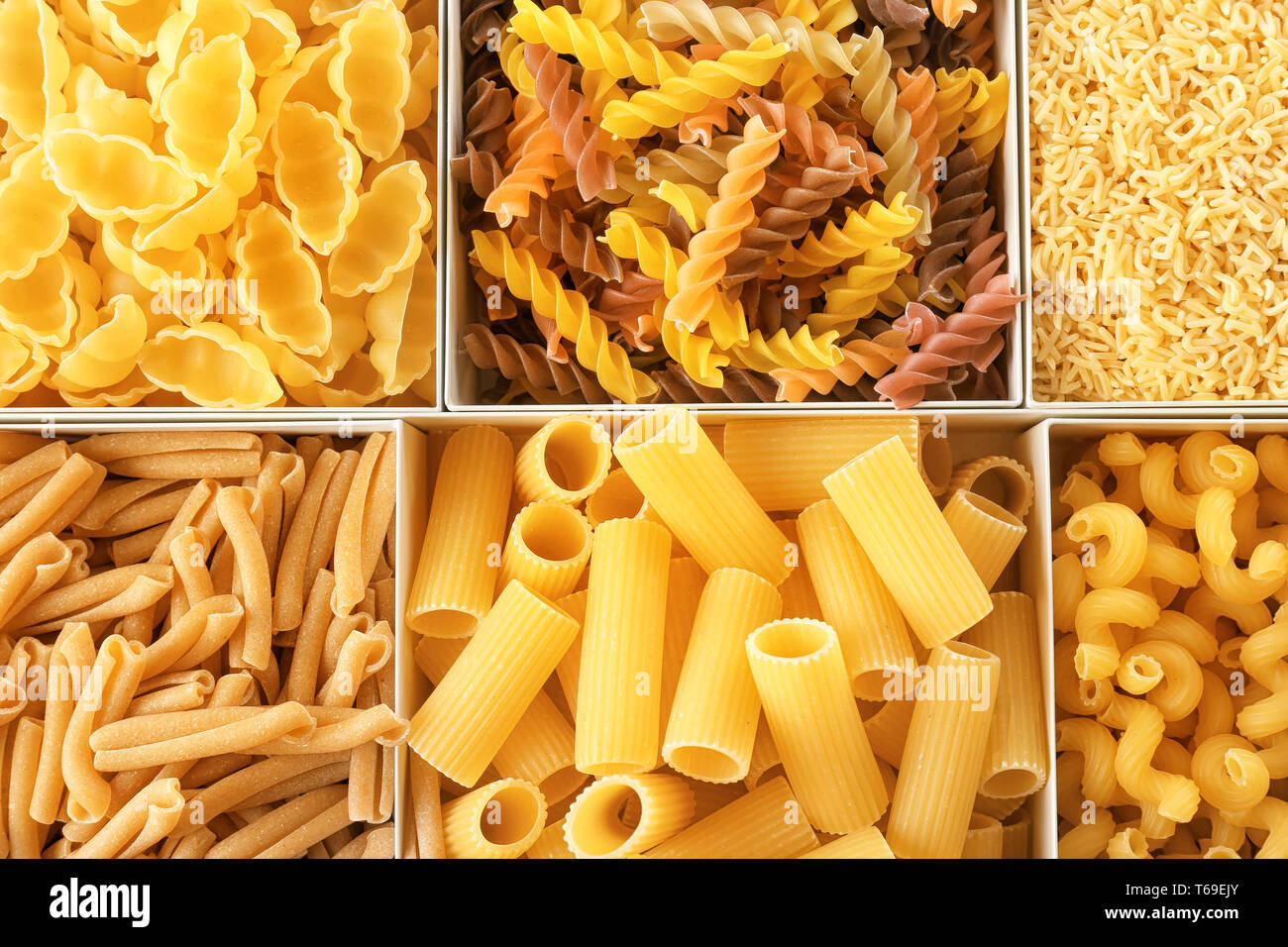Boxes with different uncooked pasta, closeup Stock Photo - Alamy