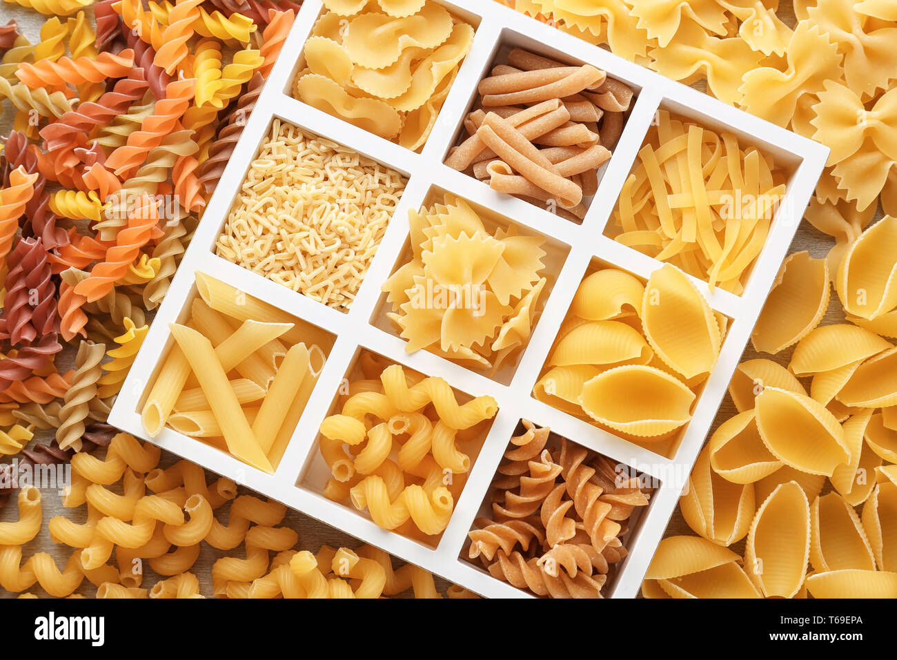 Box with different uncooked pasta, top view Stock Photo - Alamy