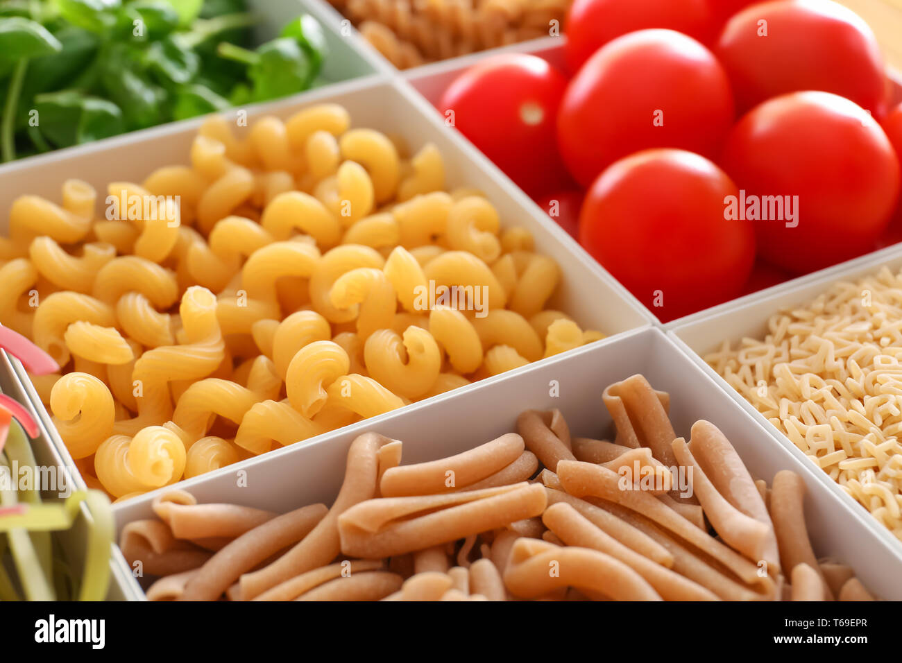 Boxes with different uncooked pasta and products, closeup Stock Photo ...