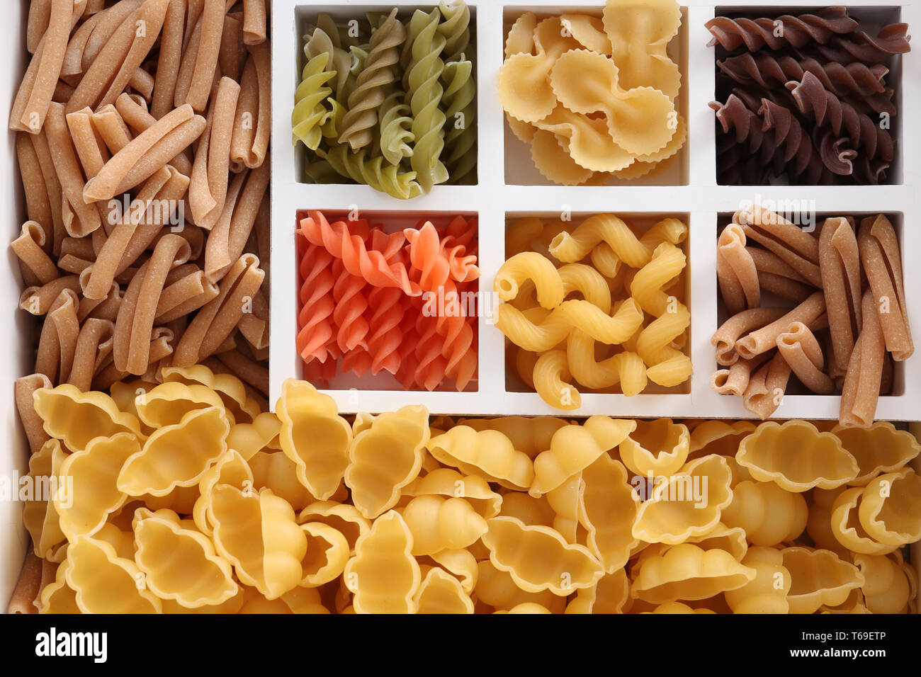 Boxes with different uncooked pasta, top view Stock Photo - Alamy