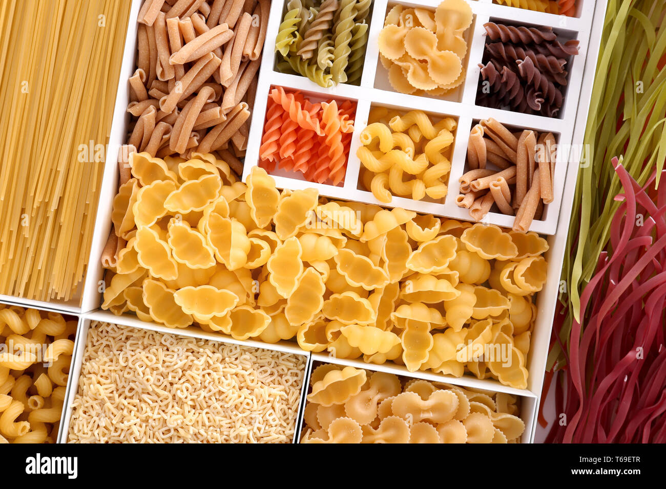 Boxes with different uncooked pasta, top view Stock Photo - Alamy