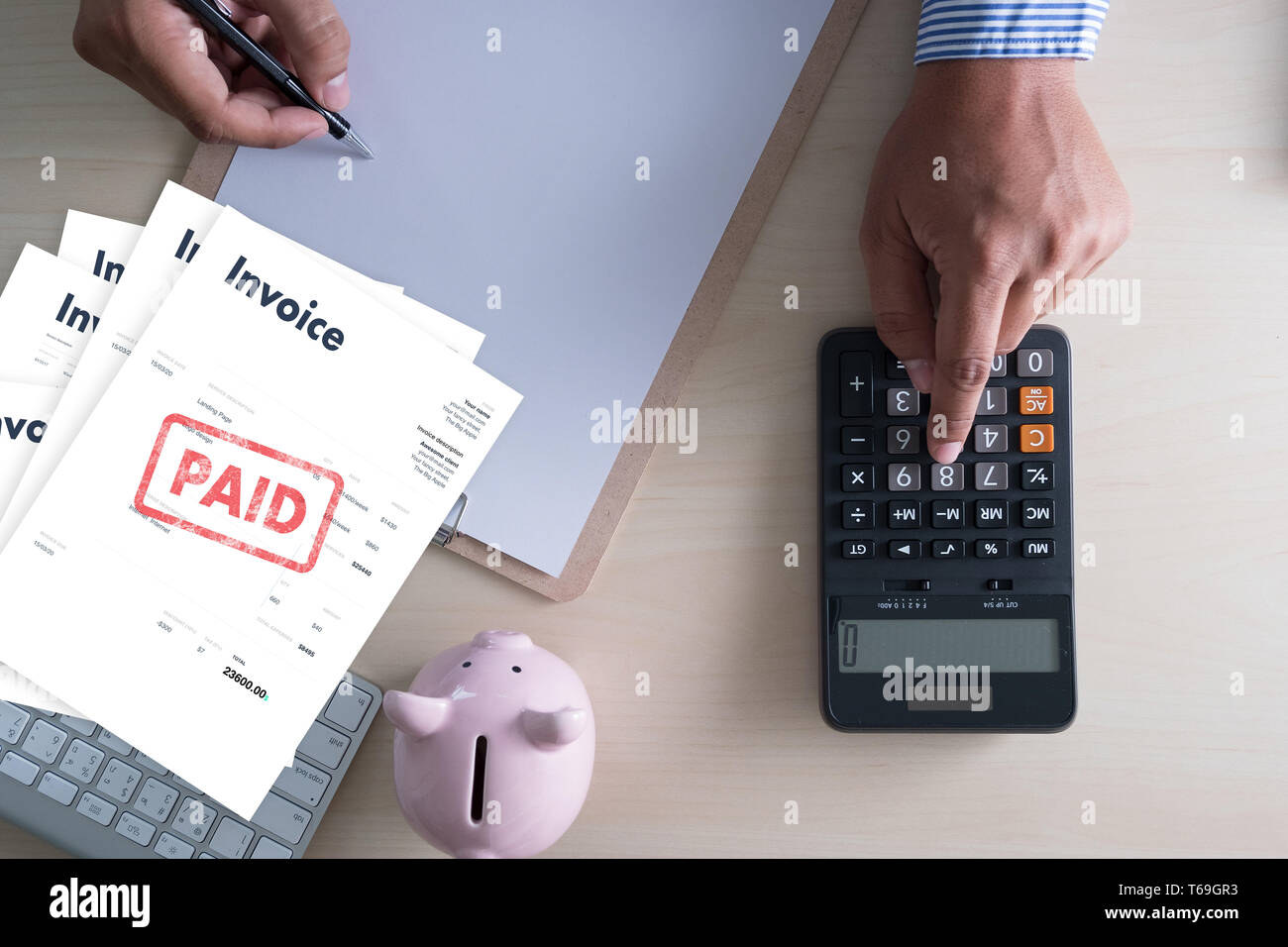 Close-up man work Invoice Bill Paid Payment At Office Invoice savings ...