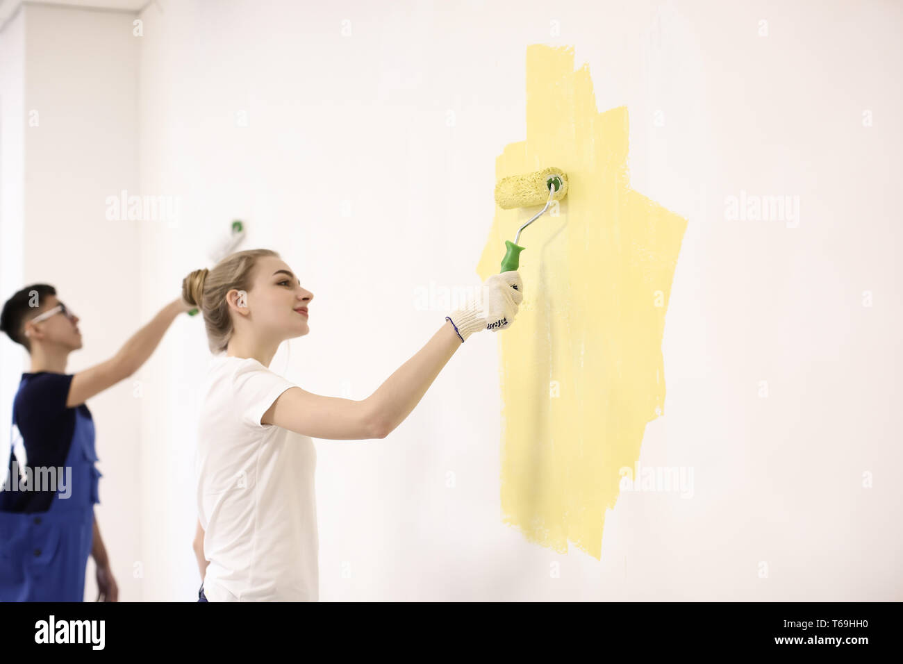 Professional painters working together indoors Stock Photo - Alamy