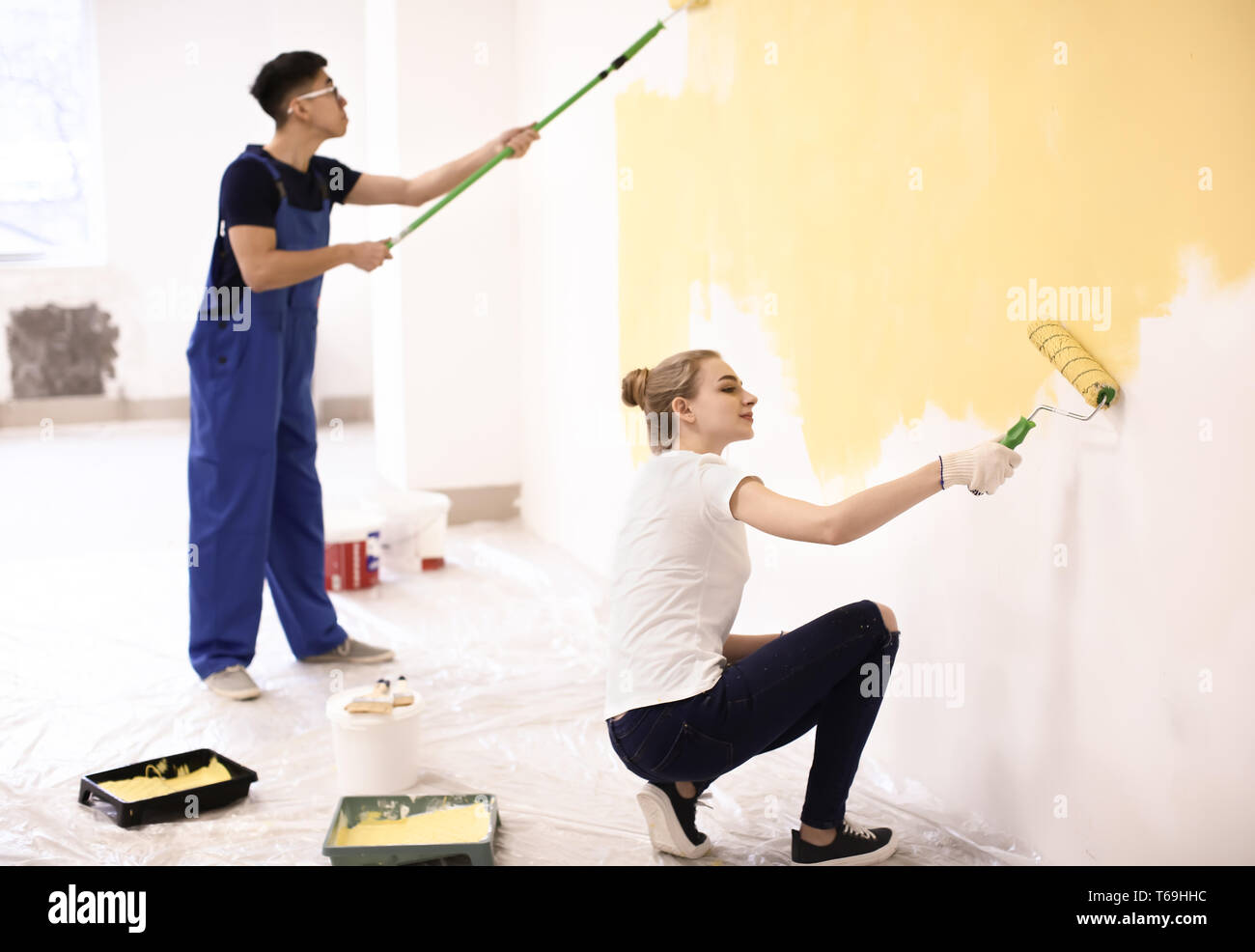 Professional painters working together indoors Stock Photo - Alamy