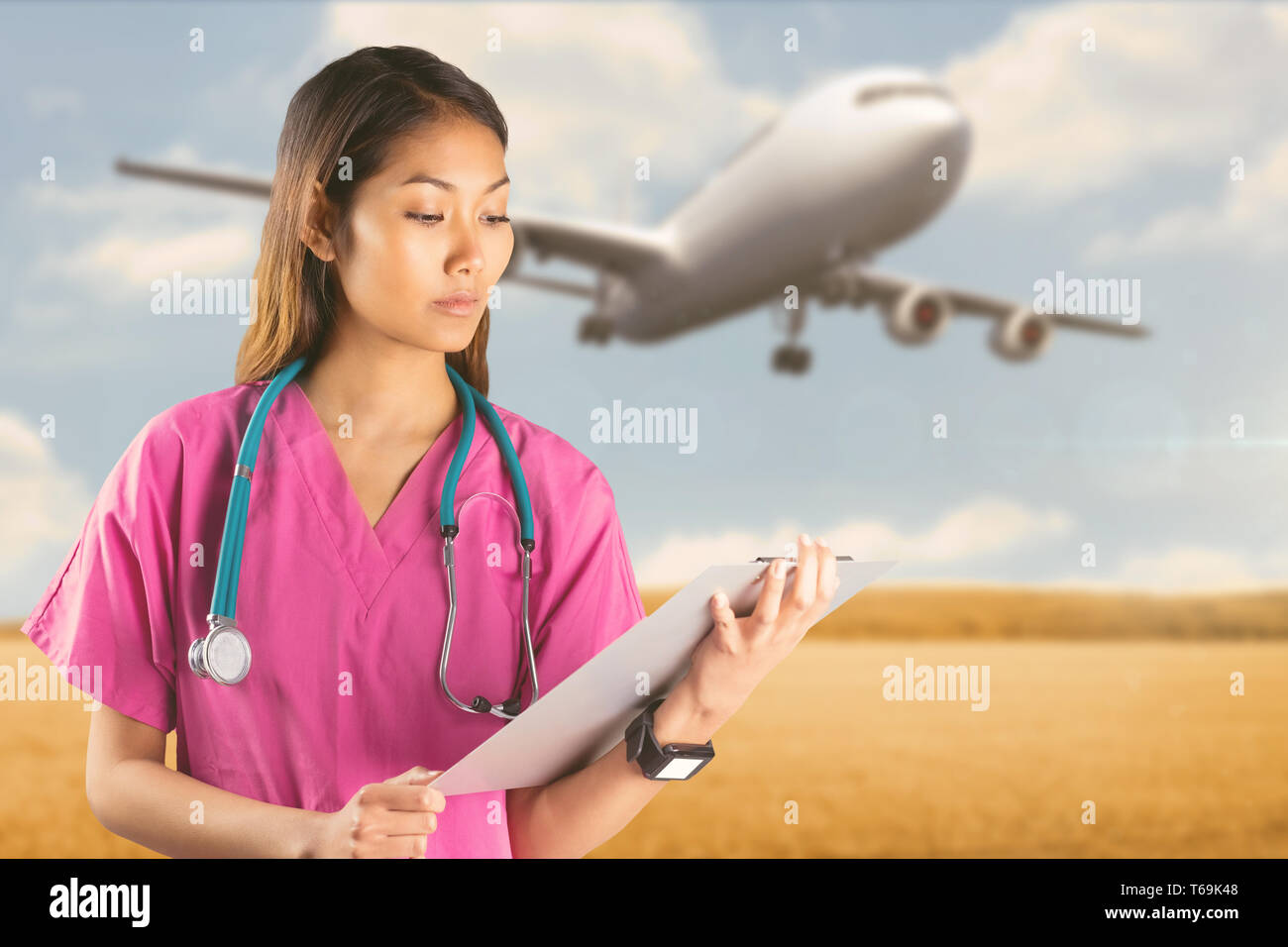 Composite image of asian nurse with stethoscope looking at the camera ...