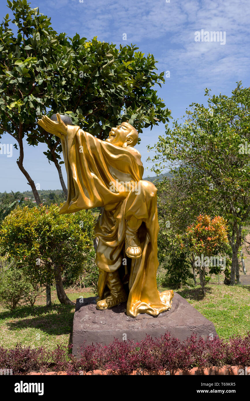 fat monk statue in complex Pagoda Ekayana Stock Photo - Alamy