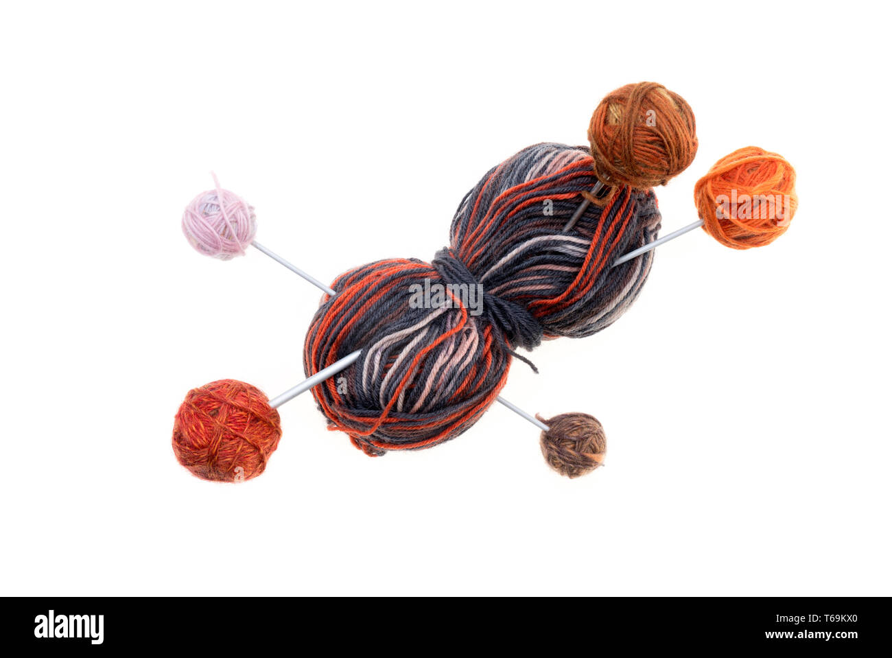 Different colored balls of wool with knitting needles Stock Photo - Alamy